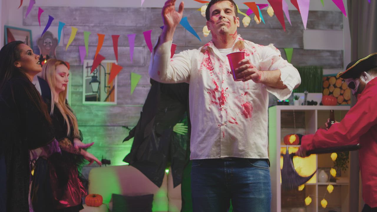 People dancing at a Halloween costume party - Free Stock Video