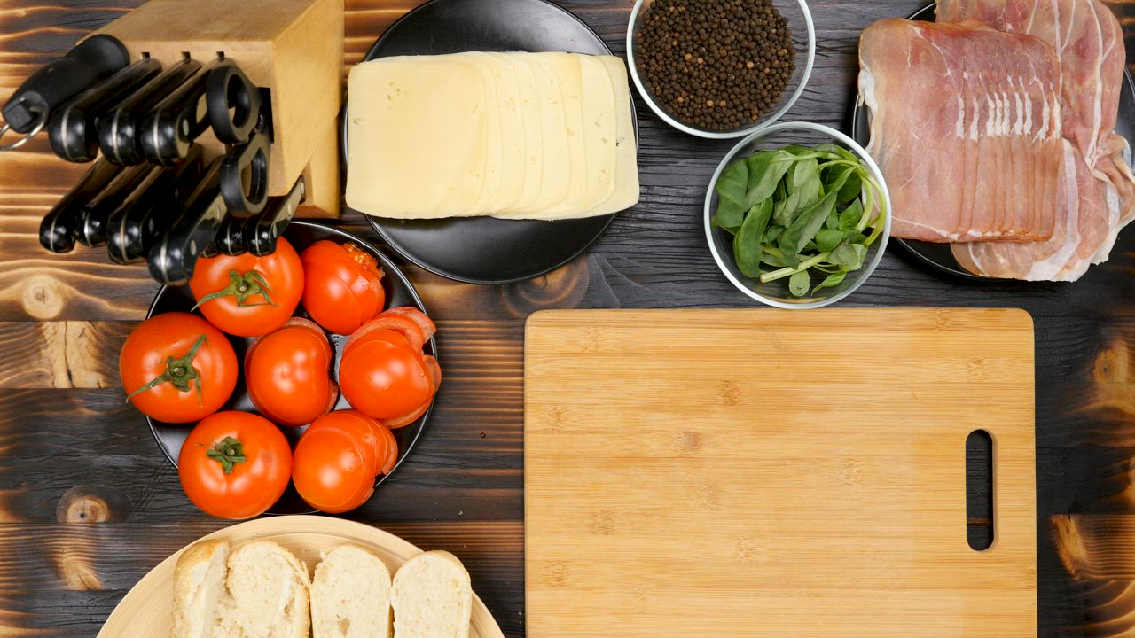Chef preparing sandwiches on a board, top shot - Free Stock Video