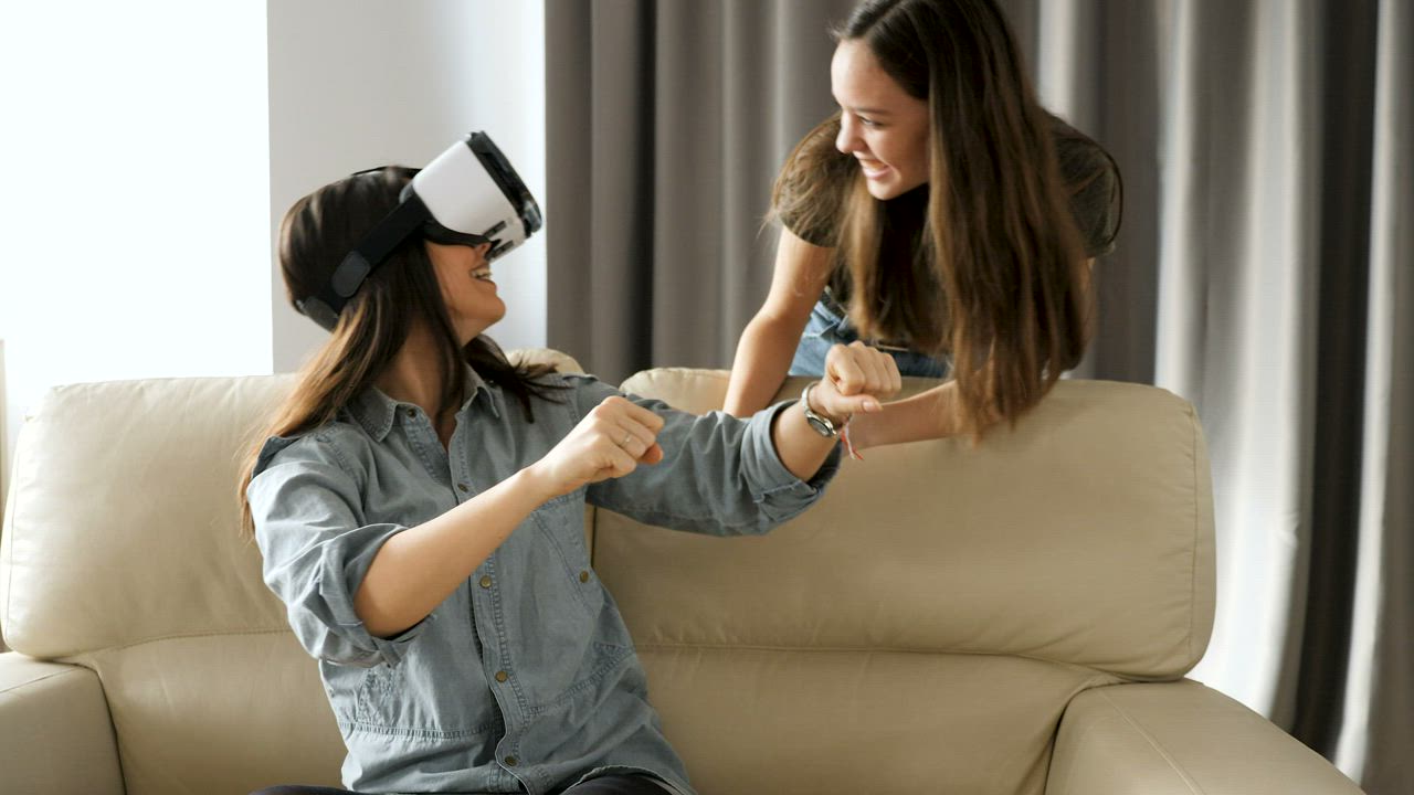 Female friends playing virtual reality video games - Free Stock Video