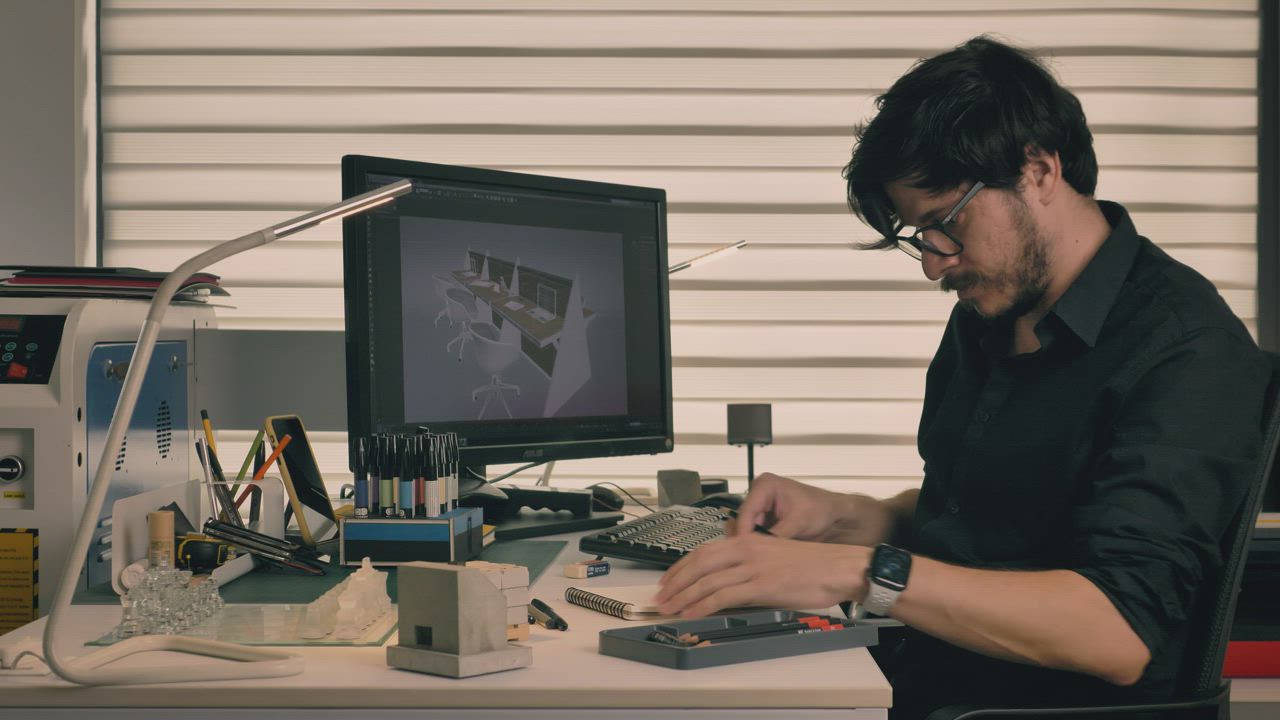 Male designer working in his studio - Free Stock Video