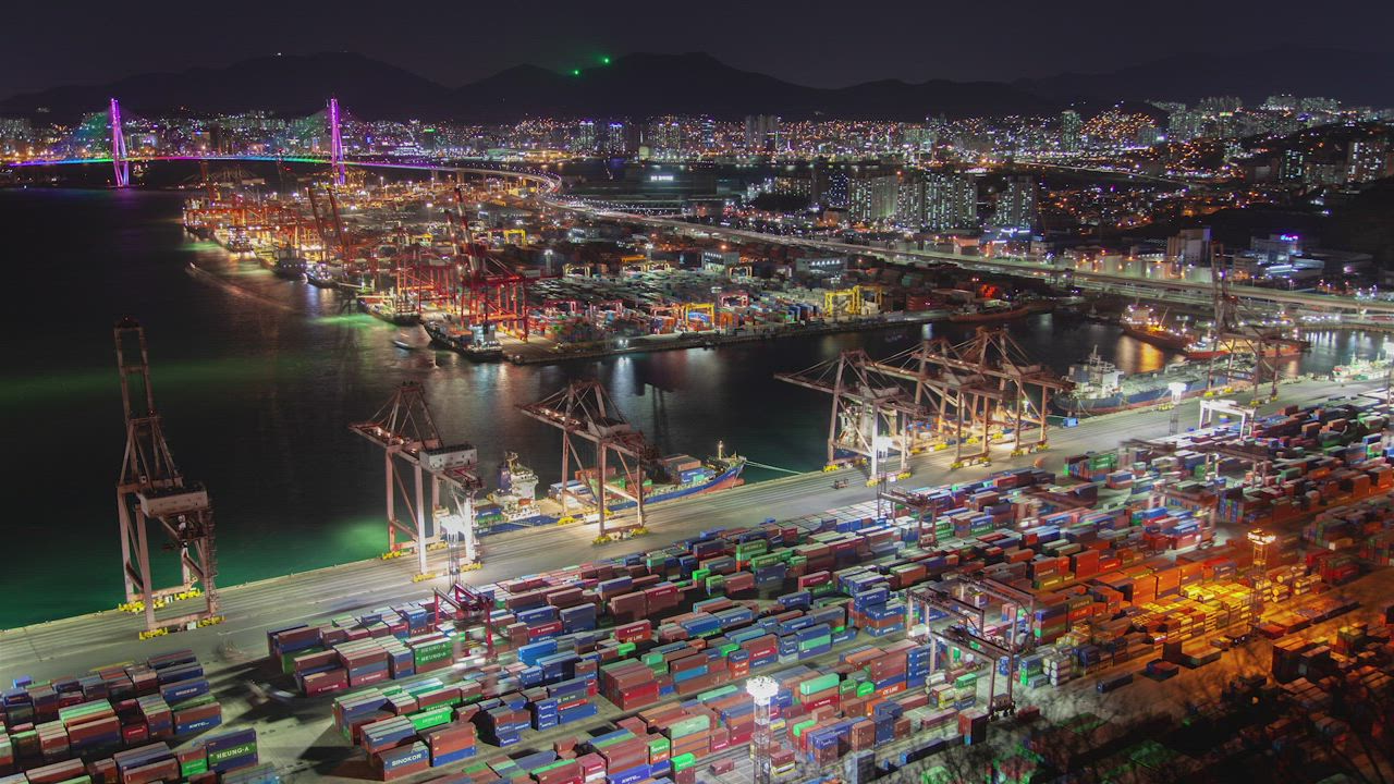 Iluminated containerport at night - Free Stock Video
