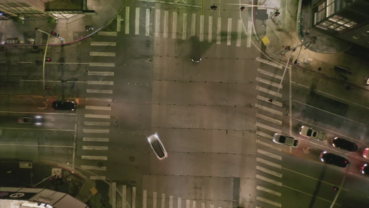 Traffic on an avenue, top zoom out aerial shot - Free Stock Video