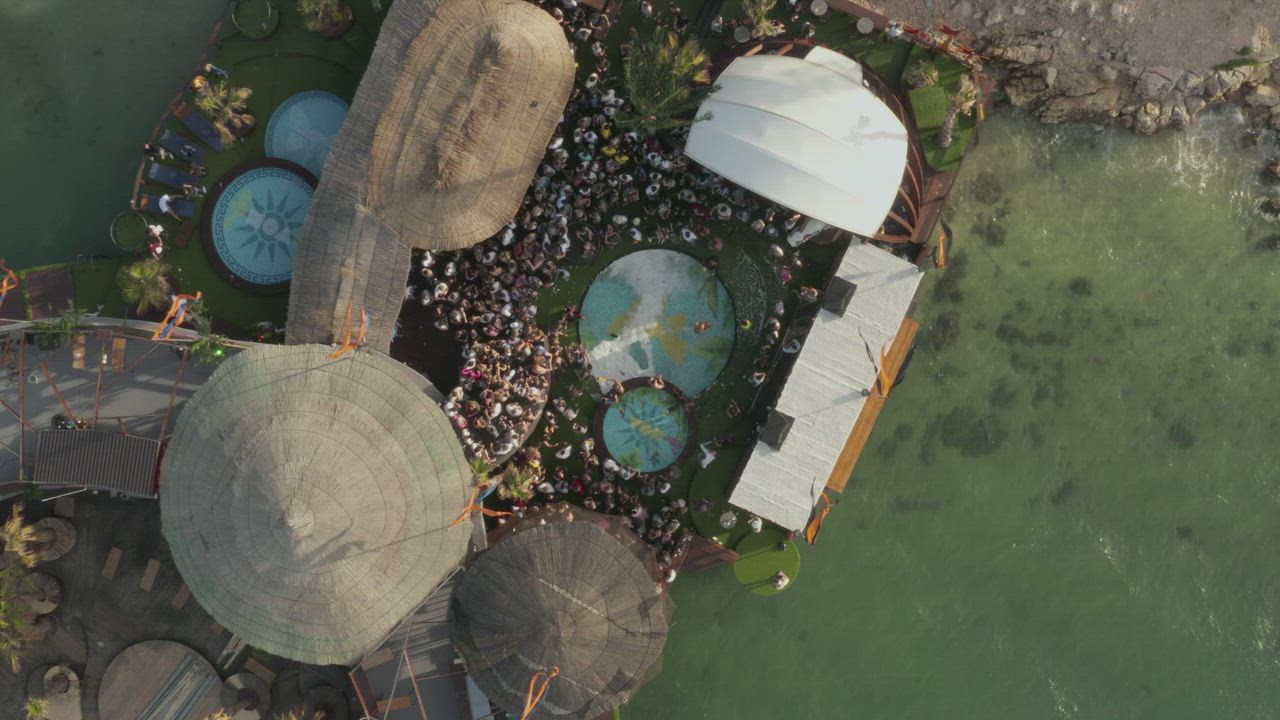 Aerial view of a small spring festival in the beach - Free Stock Video