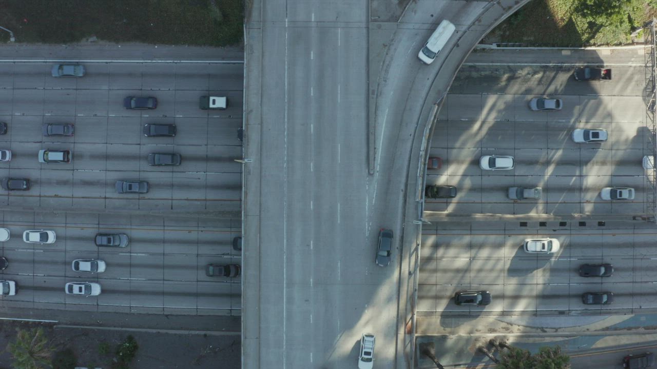 Traffic on a vehicular bridge over a highway - Free Stock Video