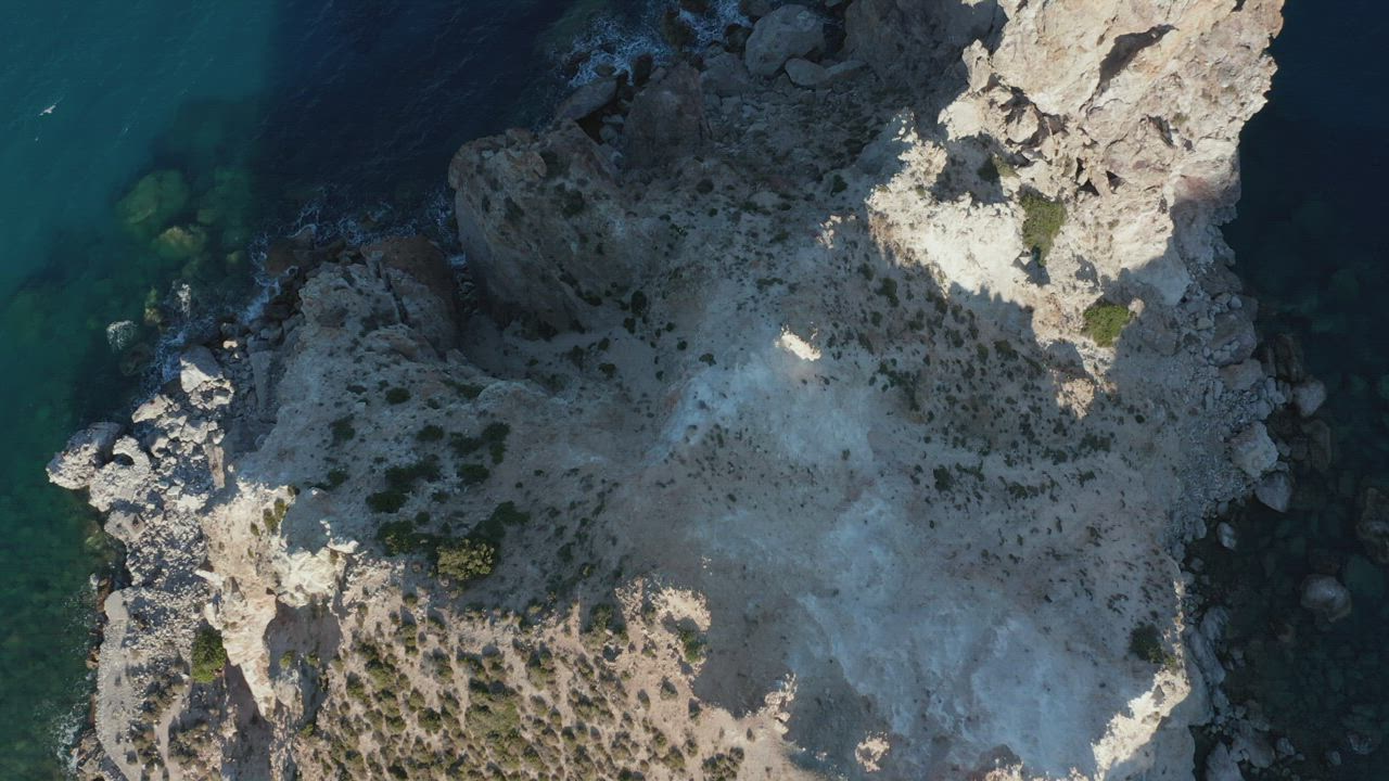Crag in the sea, top aerial shot - Free Stock Video