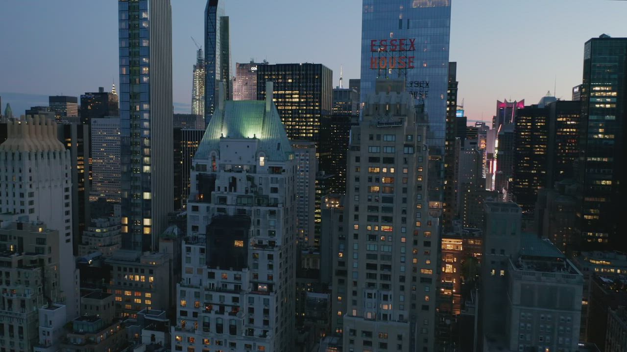 Skyscrapers at dusk, front aerial view - Free Stock Video