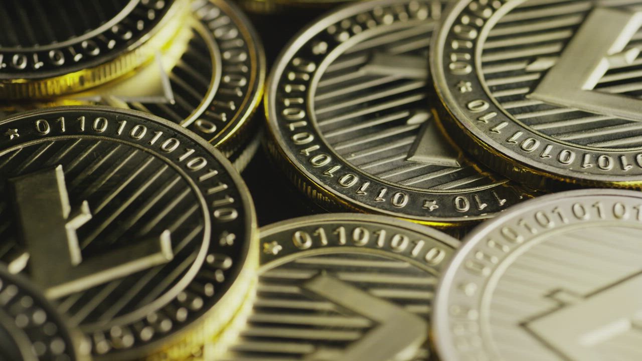 Close-up shot of lite coins rotating - Free Stock Video