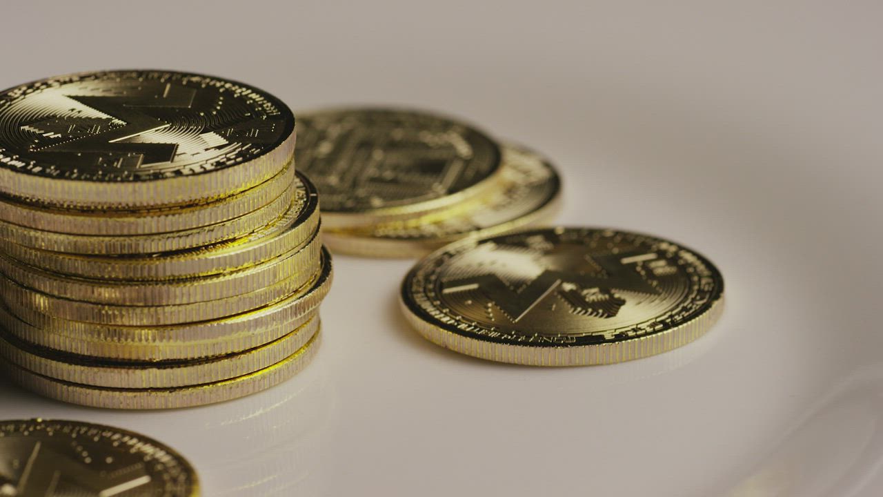 Monero coins rotating on a white surface - Free Stock Video