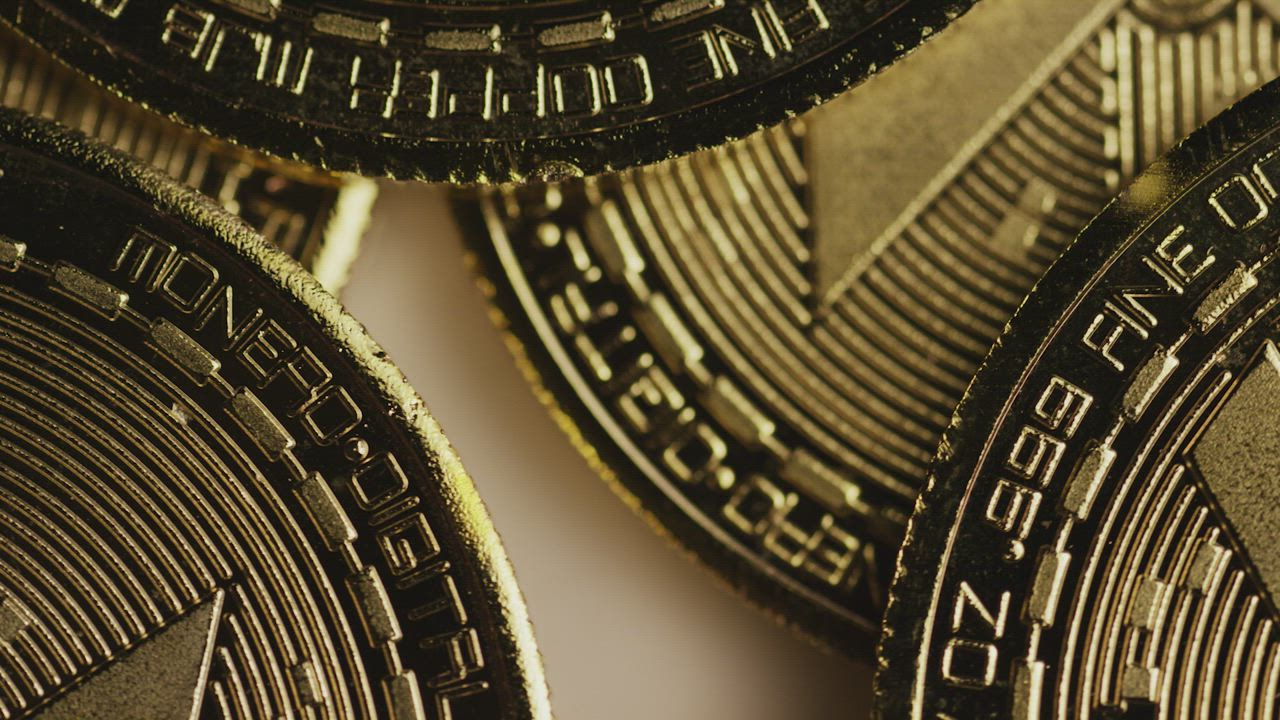 Golden Monero cryptocurrency coins rotating - Free Stock Video