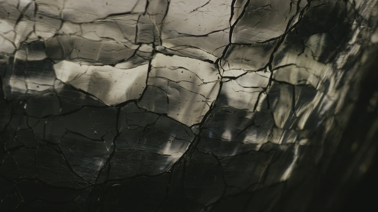 Crackhead texture with a light in the background - Free Stock Video