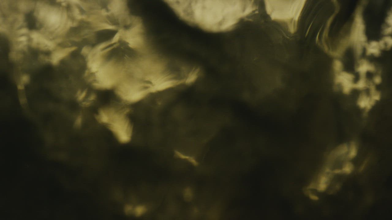 Light through distorted glass texture - Free Stock Video