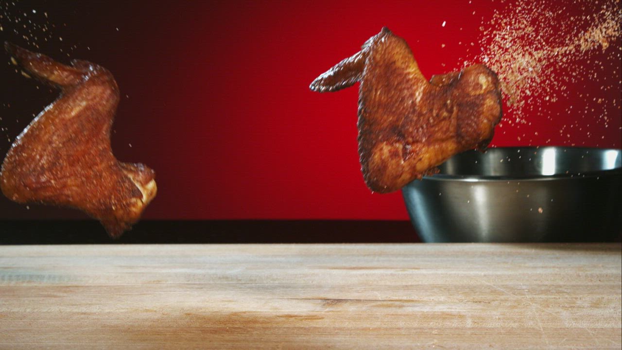 Chicken wings falling in slow motion - Free Stock Video