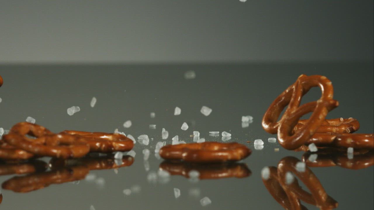 Pretzels falling in slow motion - Free Stock Video