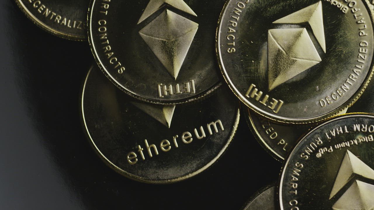 Ethereum golden coins shine and rotate - Free Stock Video