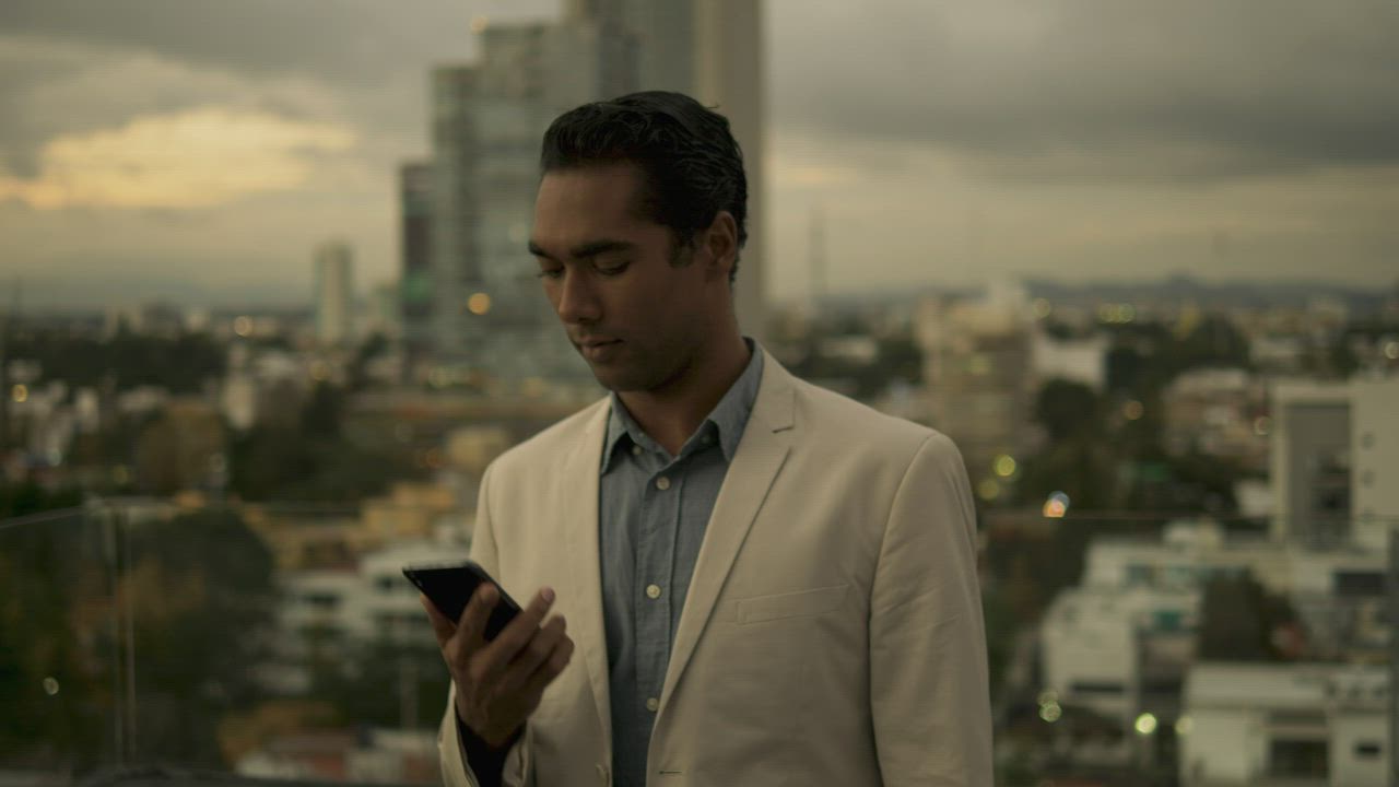 Man in suit making a phone call outside - Free Stock Video