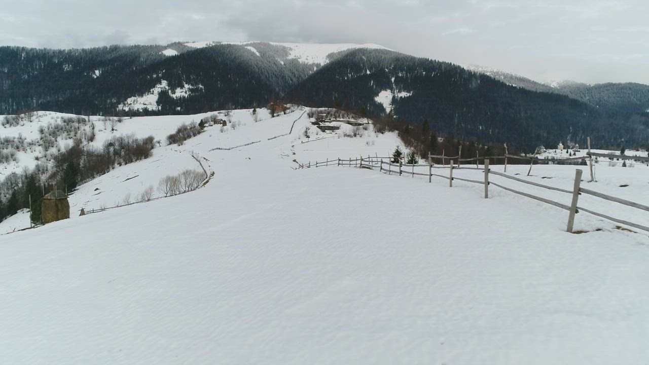 Slowly going down a snowy slope on a mountain - Free Stock Video