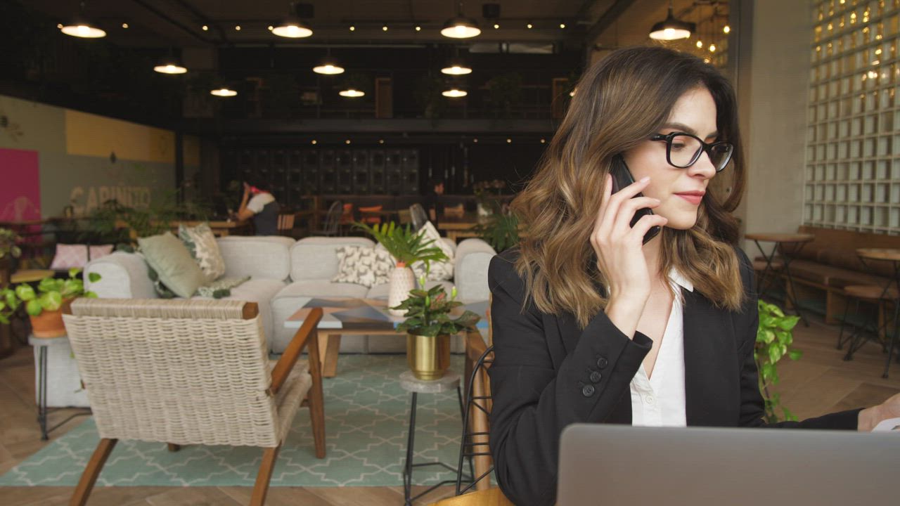 Businesswoman making a phone call in office - Free Stock Video