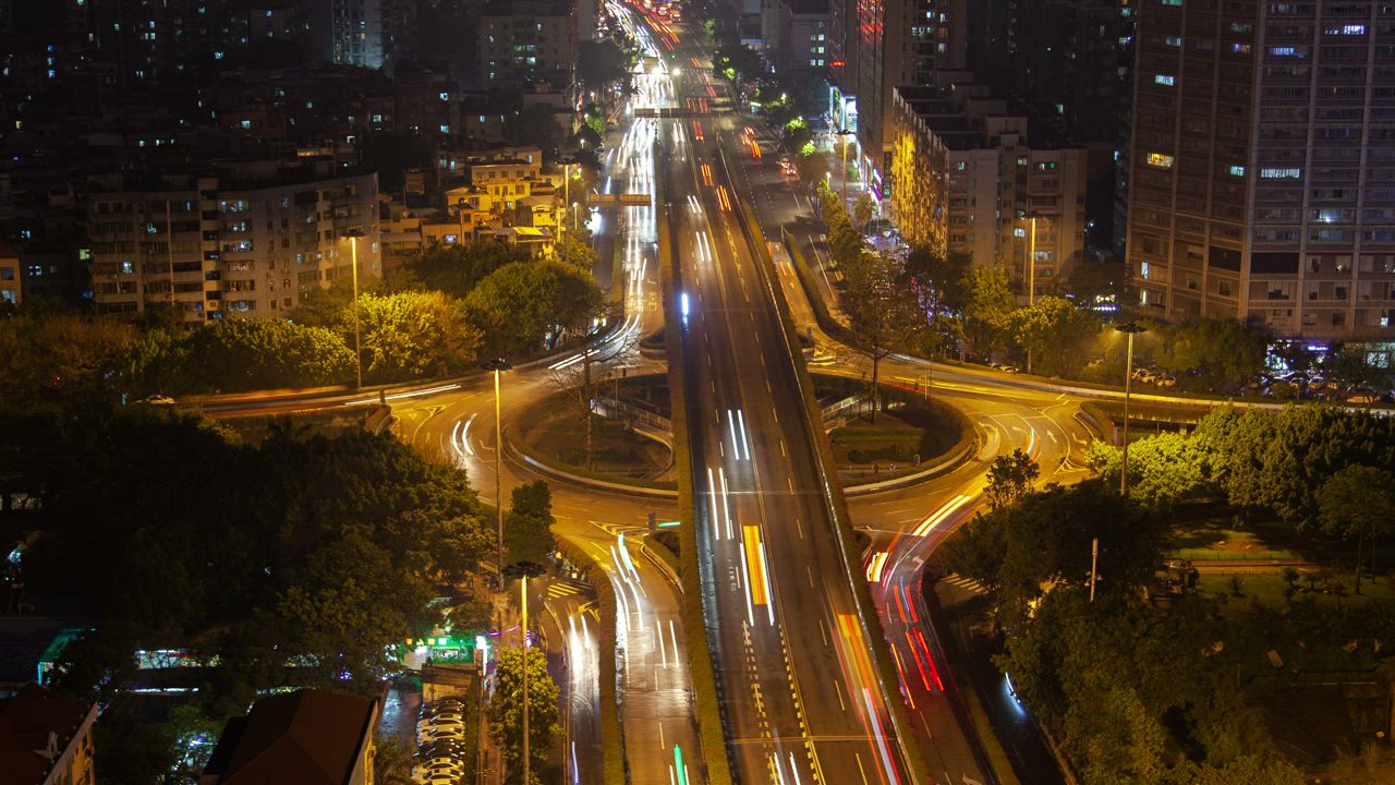 Roundabout with fast motion traffic - Free Stock Video