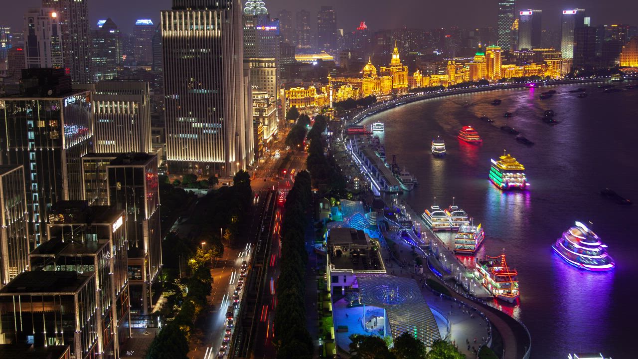 Shanghaiing city scape in the river at night - Free Stock Video