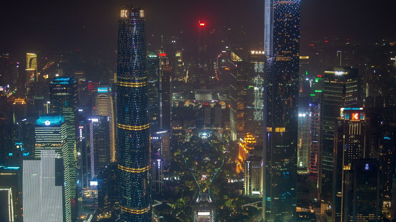 City buildings flashing in the night - Free Stock Video