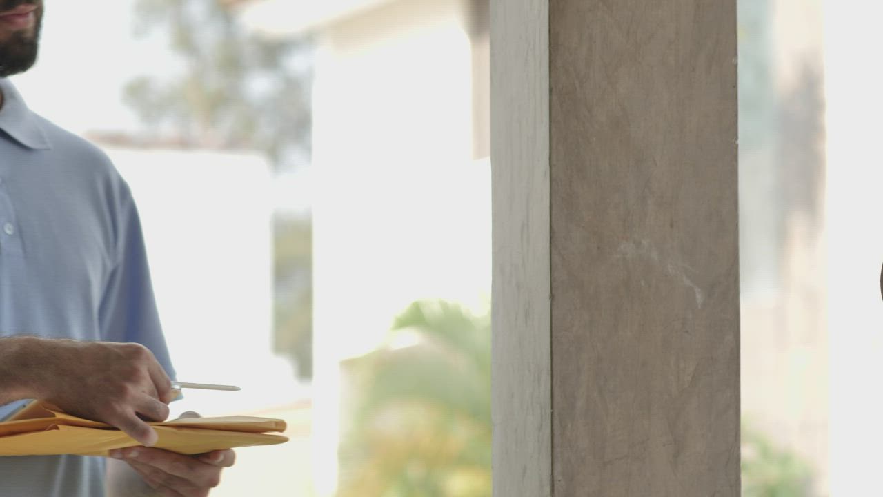 Postman delivering envelopes to a person at home - Free Stock Video