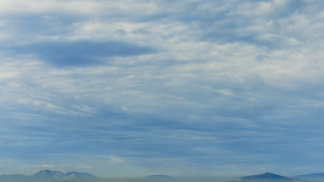 White clouds moving over the mountains - Free Stock Video