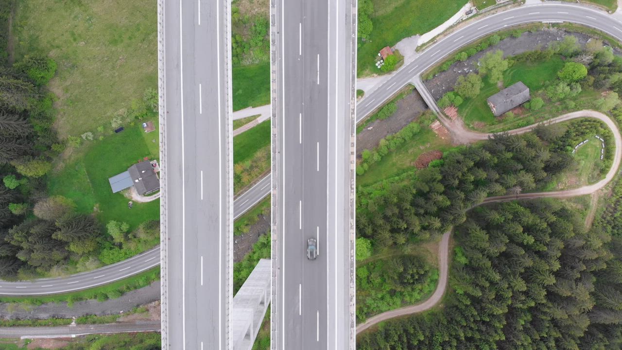 Aerial top view of a concrete highway overpass - Free Stock Video
