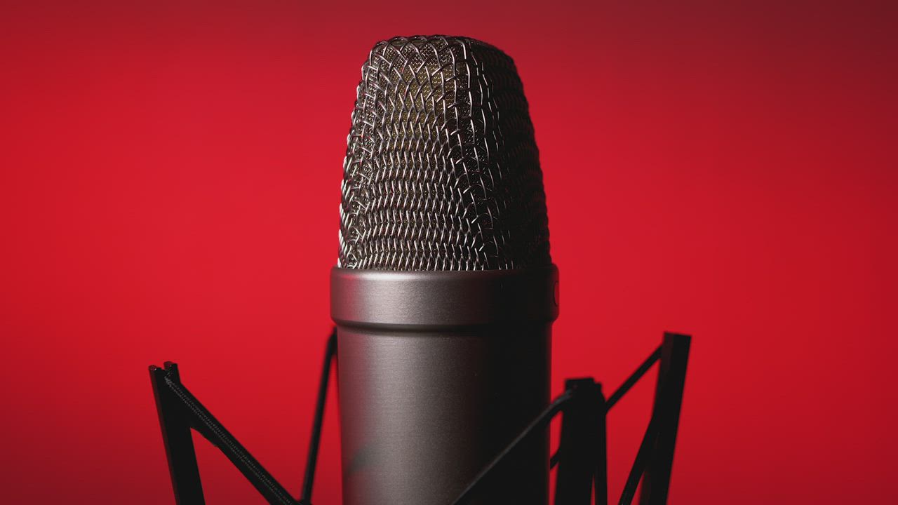 Professional microphone on a red background - Free Stock Video
