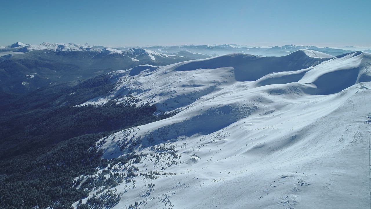 Beautiful snowy winter landscape from the air - Free Stock Video