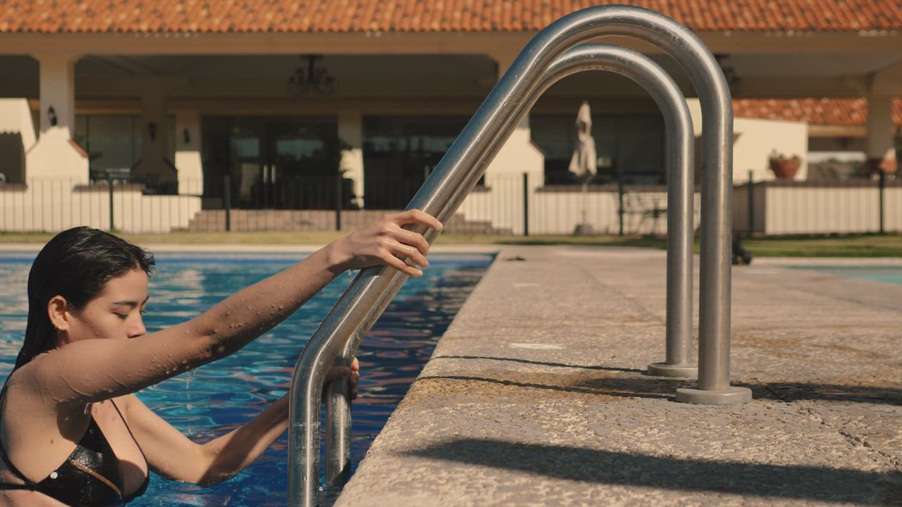 Woman coming out of the pool - Free Stock Video