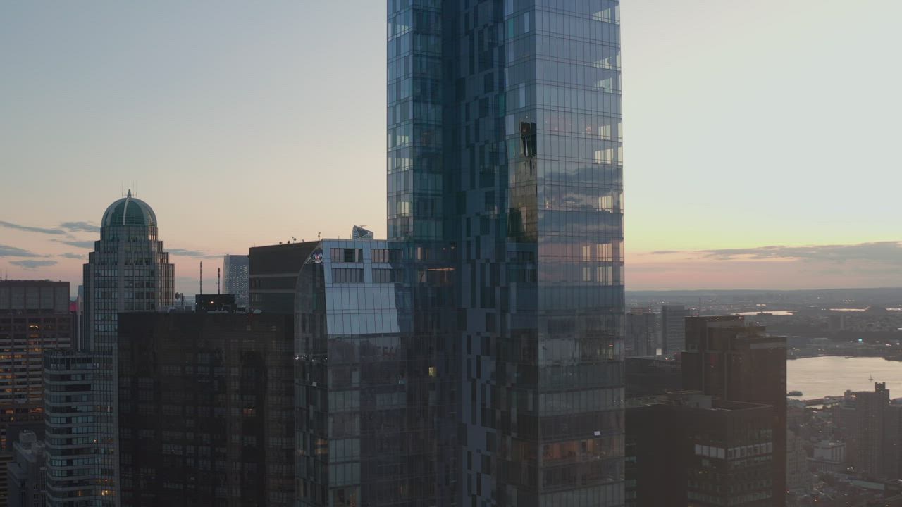 Skyscrapers and buildings during sunset - Free Stock Video
