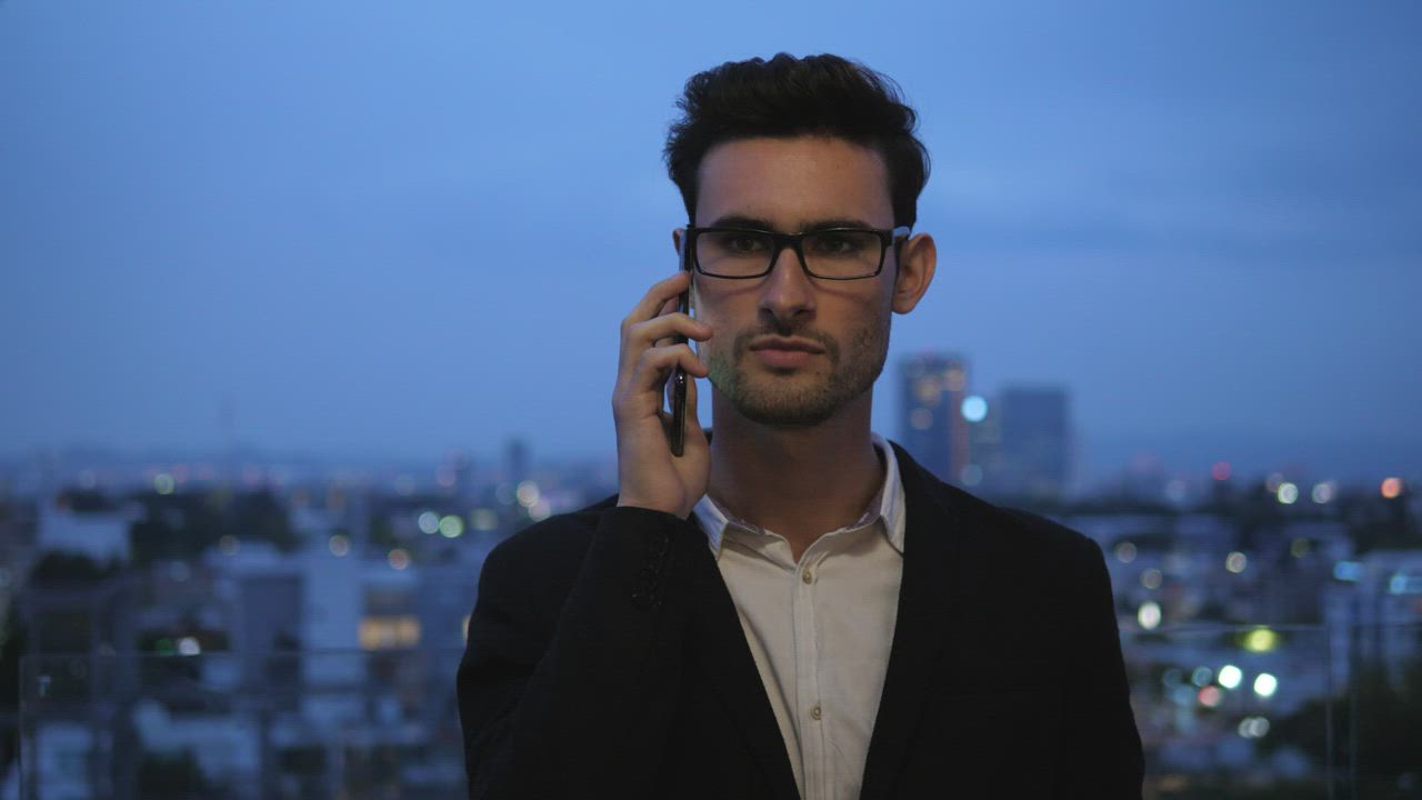 Businessman taking a phone call - Free Stock Video
