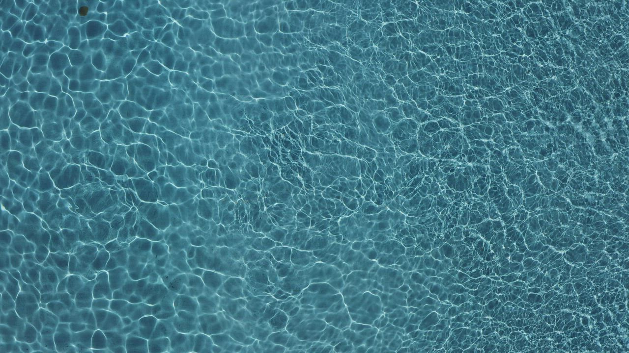 Swimming pool water, top aerial shot - Free Stock Video