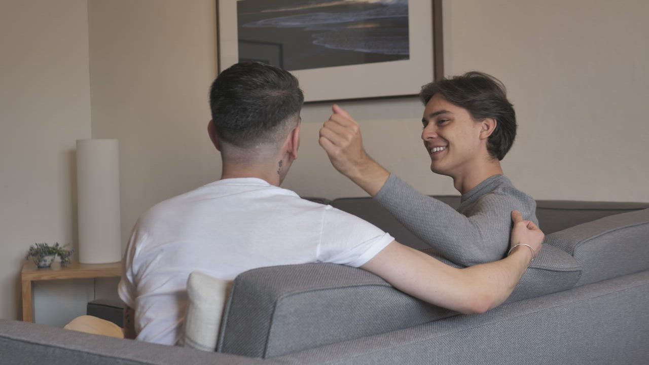 Couple talking in the sofa - Free Stock Video