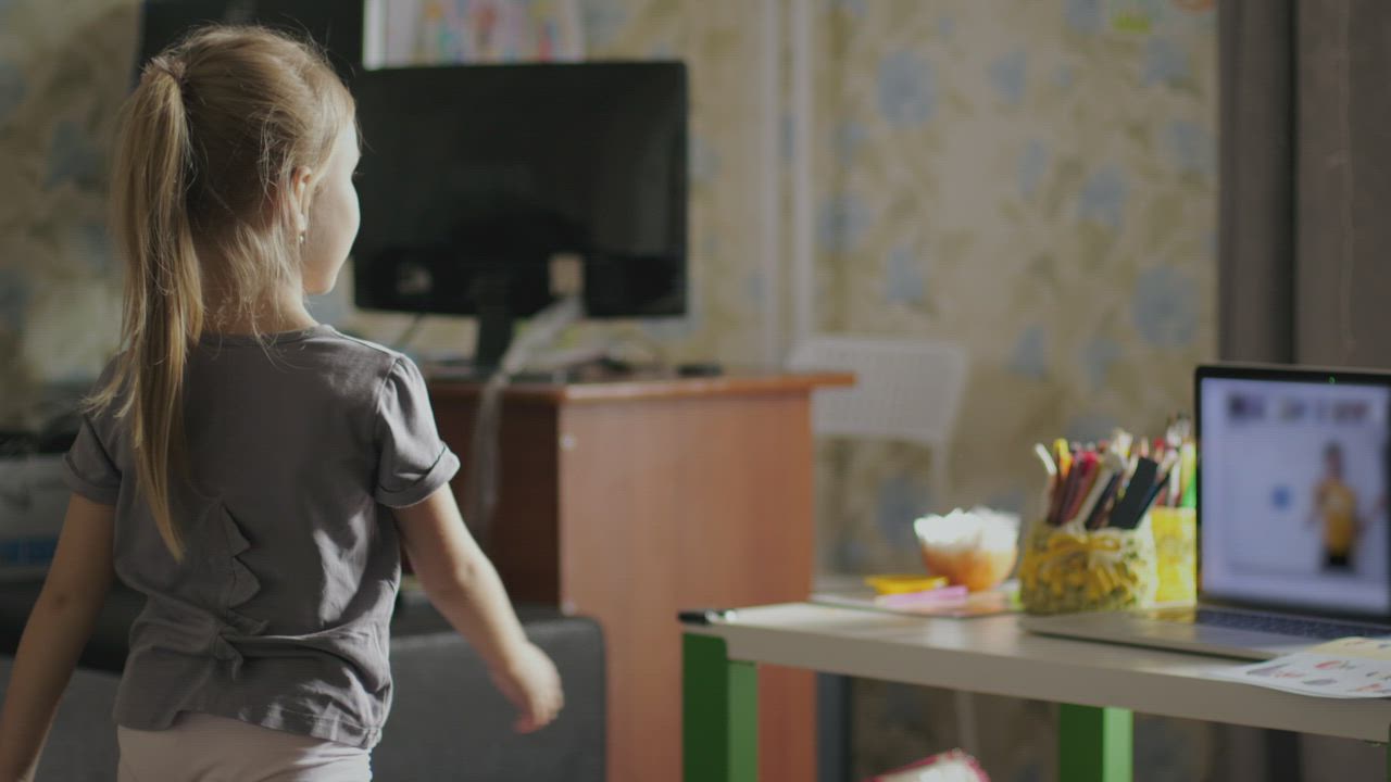 Girl on dancing class in front of the computer - Free Stock Video