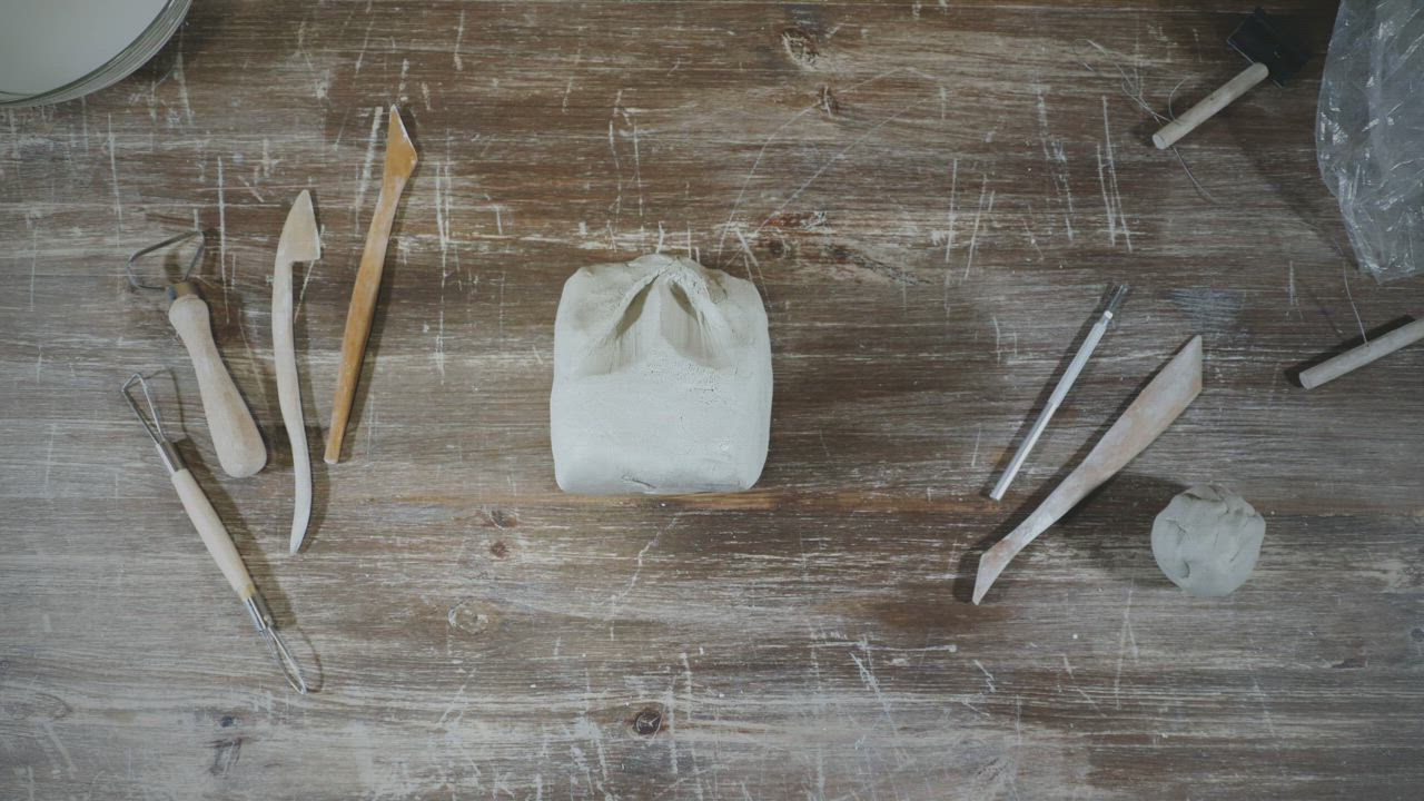 Hands working with clay in the workshop table - Free Stock Video