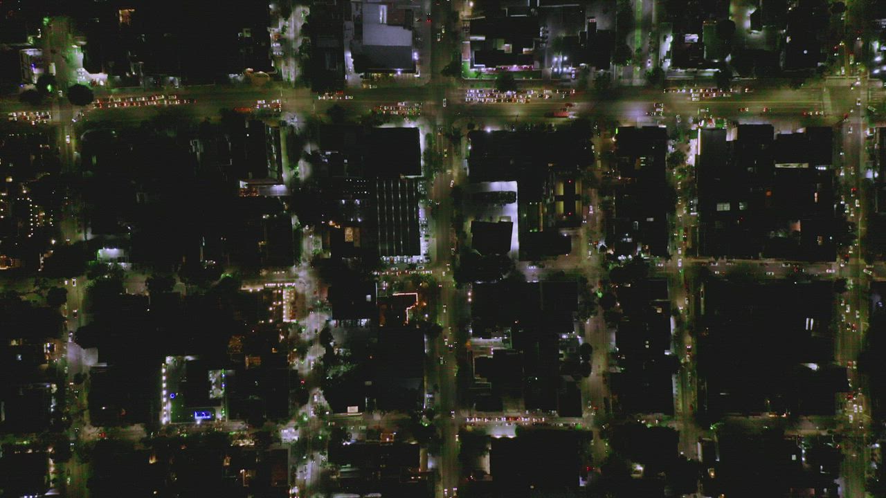 Aerial view of the city streets at night - Free Stock Video