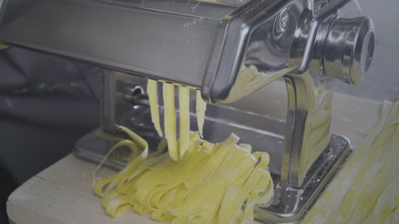 Making pasta with professional equipment - Free Stock Video