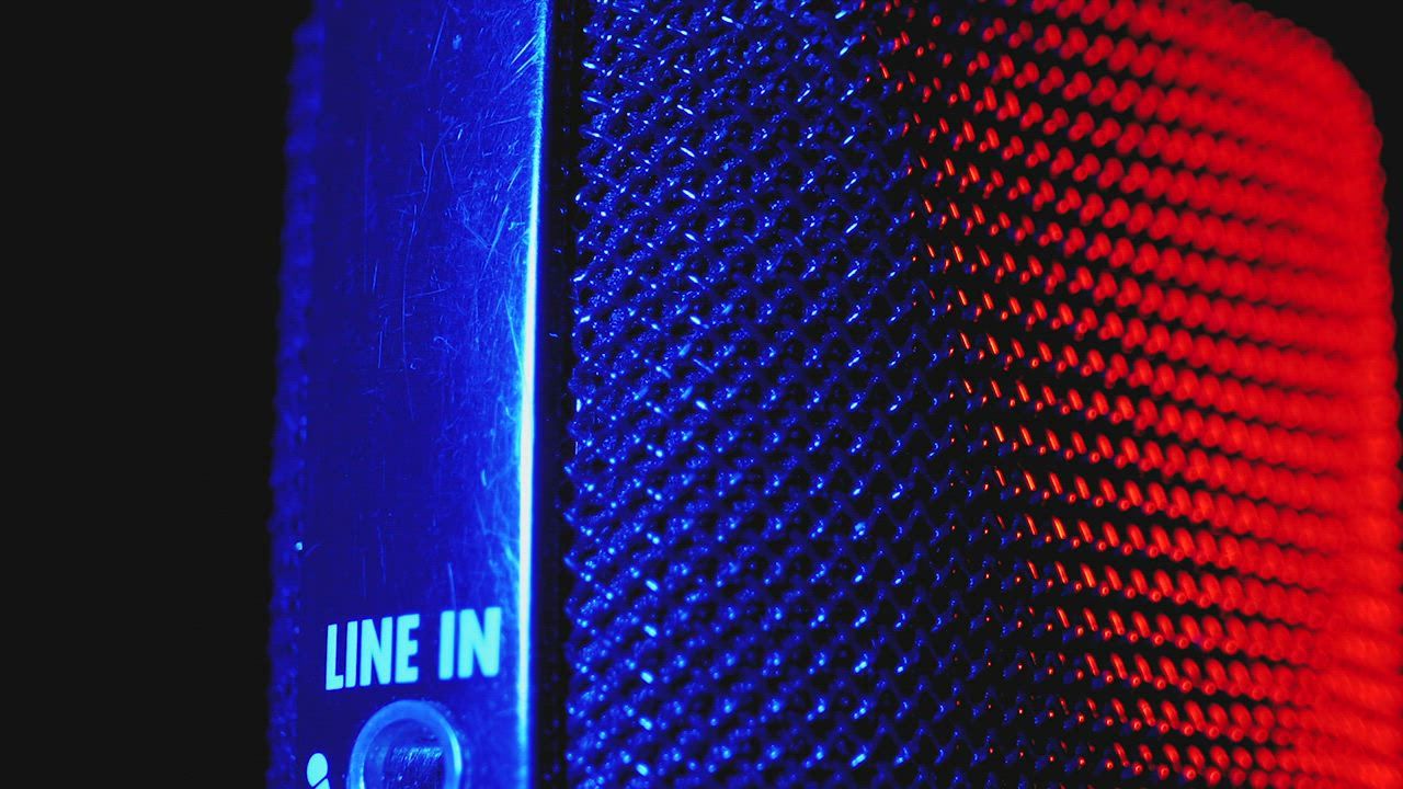 Macro shot of a microphone with red and blue light - Free Stock Video