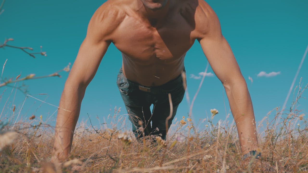 Strongman doing push outs outdoors - Free Stock Video