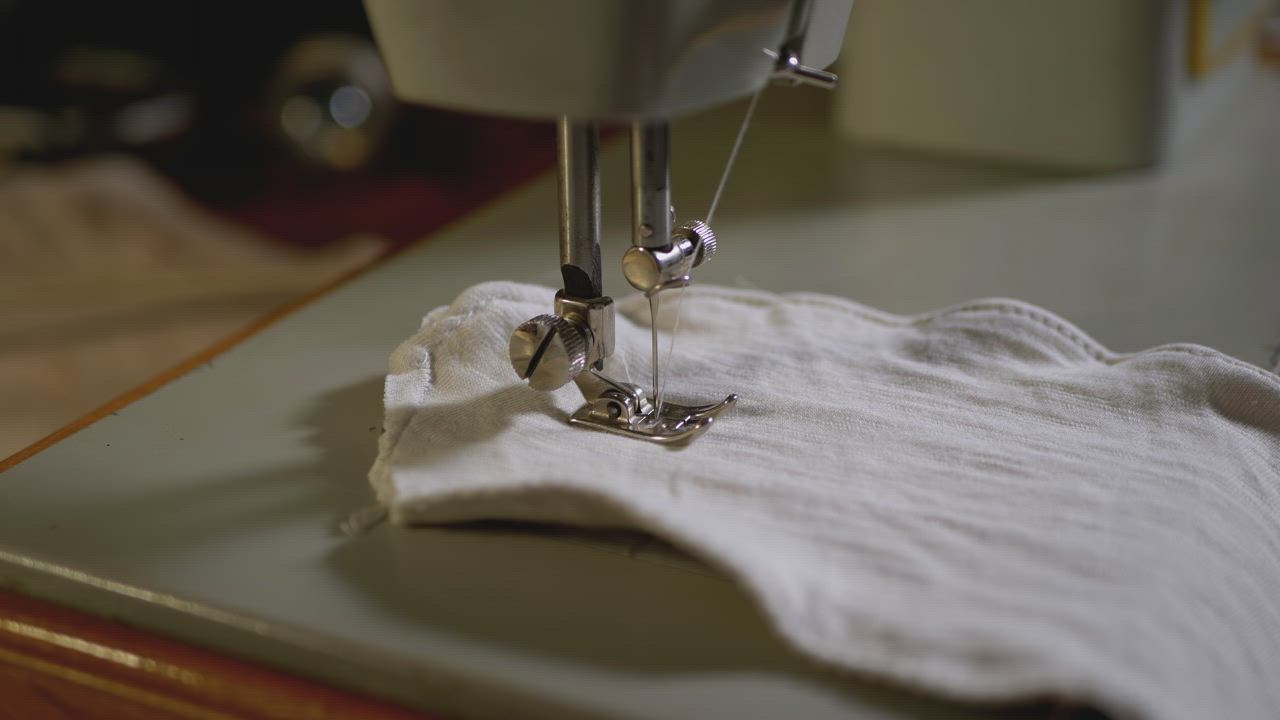 Sewing machine needle working in slow motion - Free Stock Video