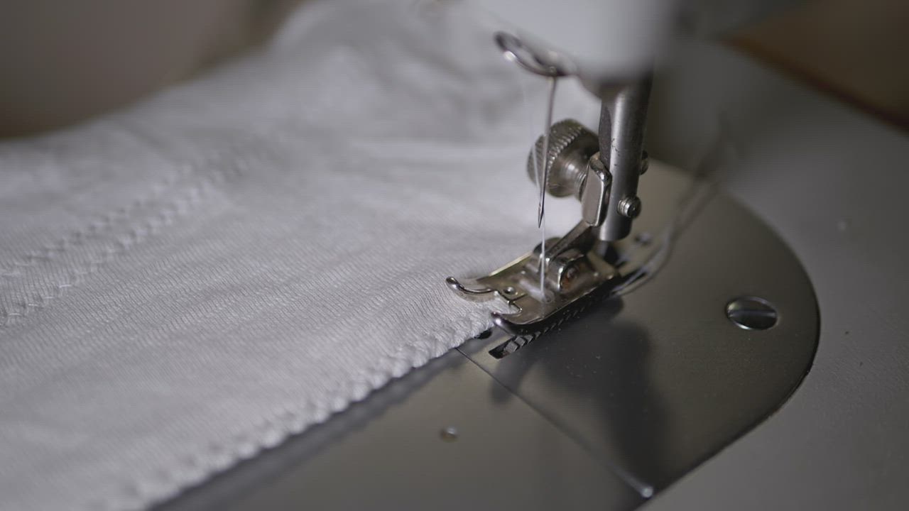 Close up of the needle of a sewing machine at work - Free Stock Video