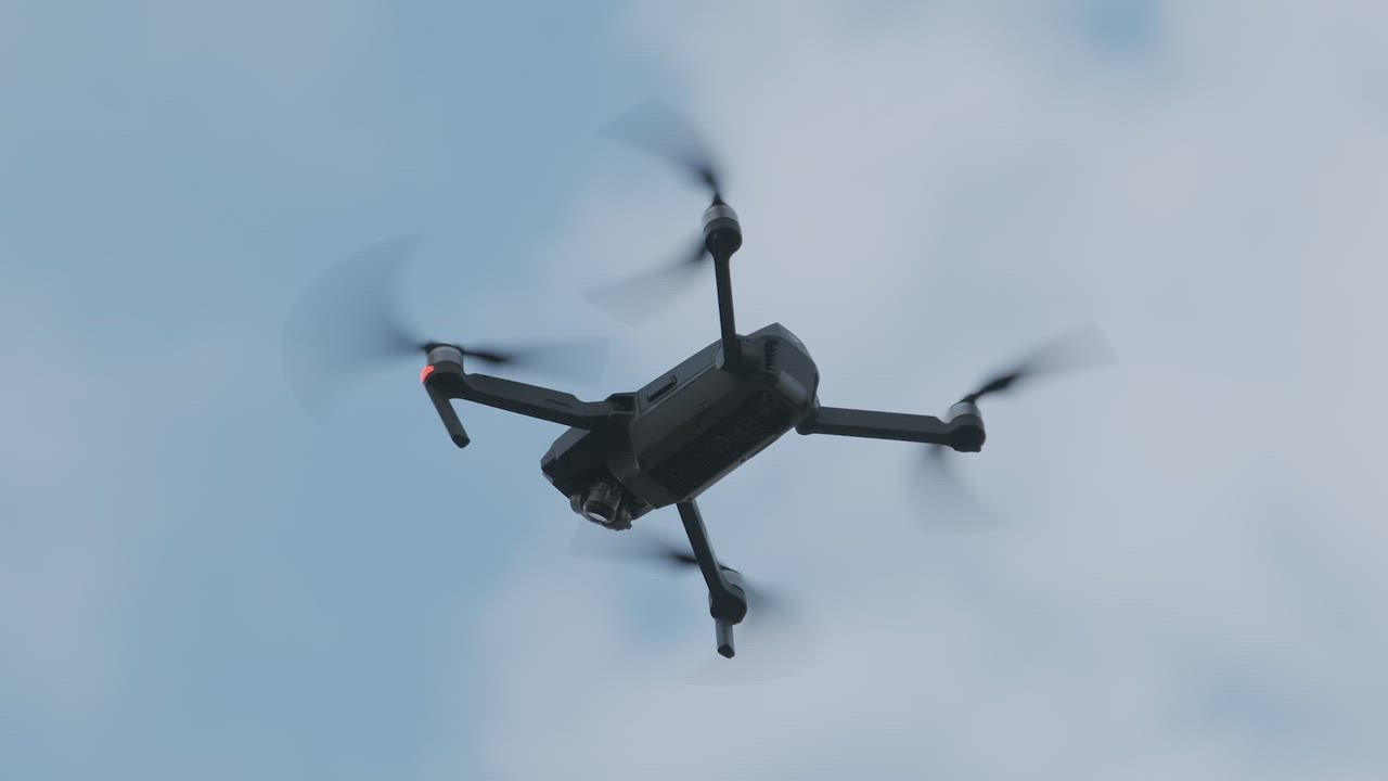 Low view of a drone flying against the sky - Free Stock Video