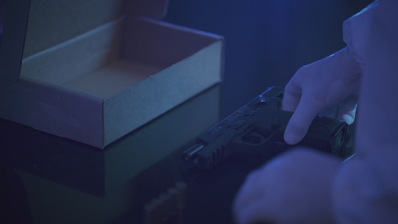 Forensic personnel saving evidence in a box - Free Stock Video