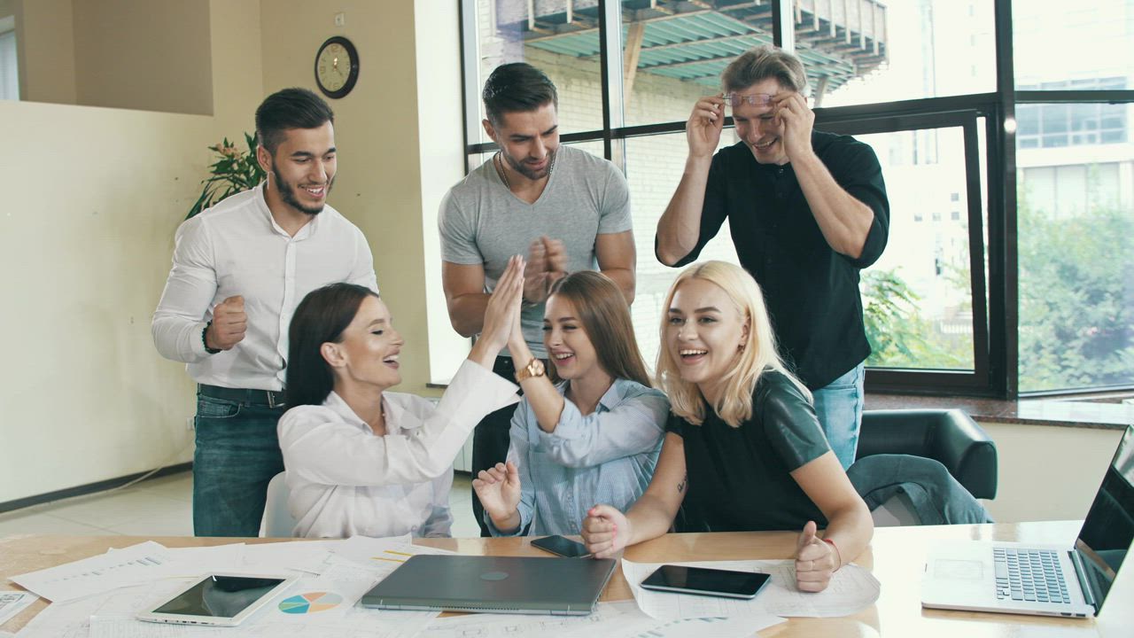 Happy workgroup for successfully closing a deal - Free Stock Video
