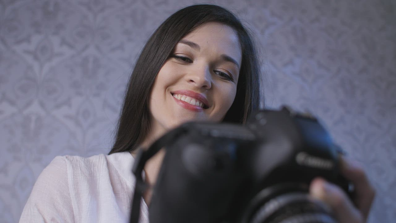 Excited and happy woman watching photos - Free Stock Video