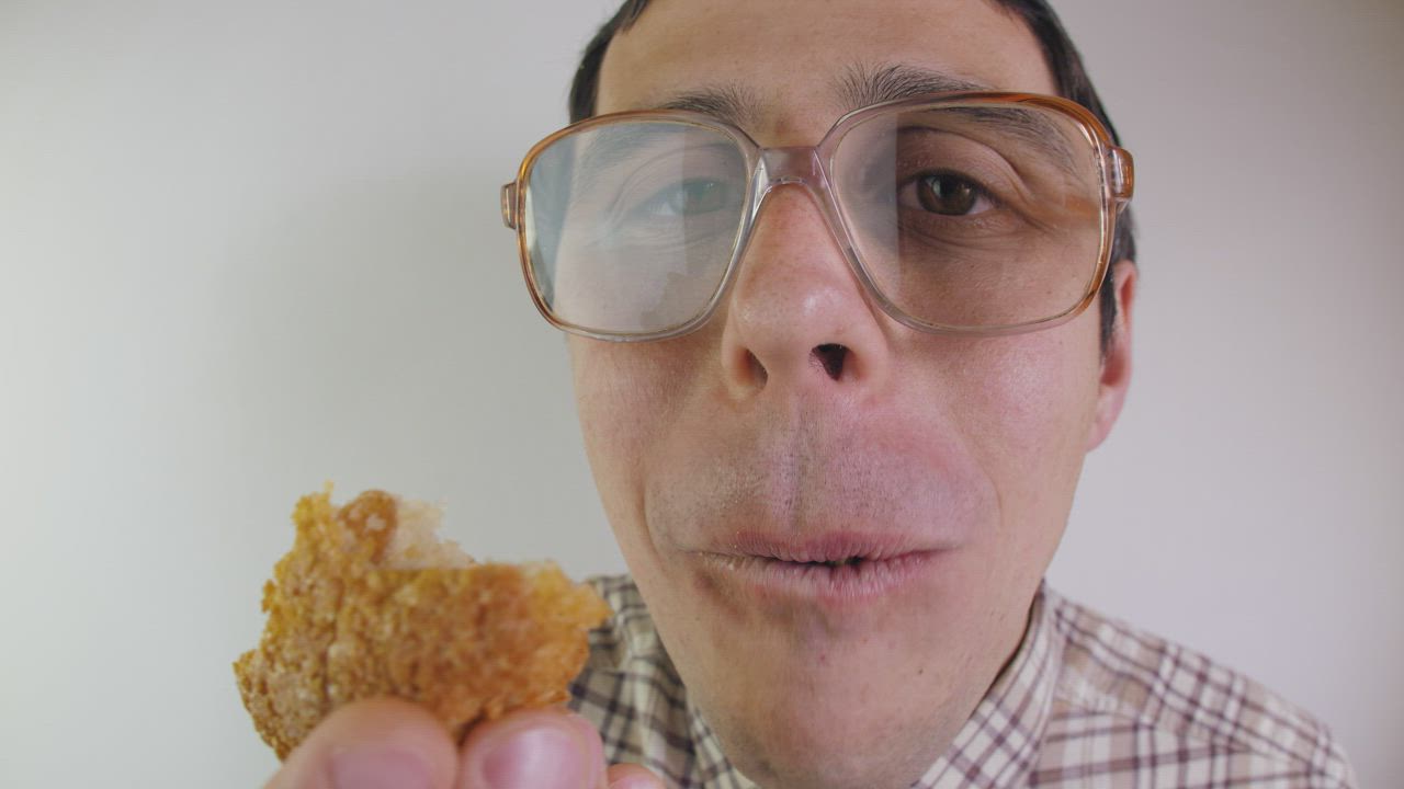 Nerdy man eating, portrait - Free Stock Video