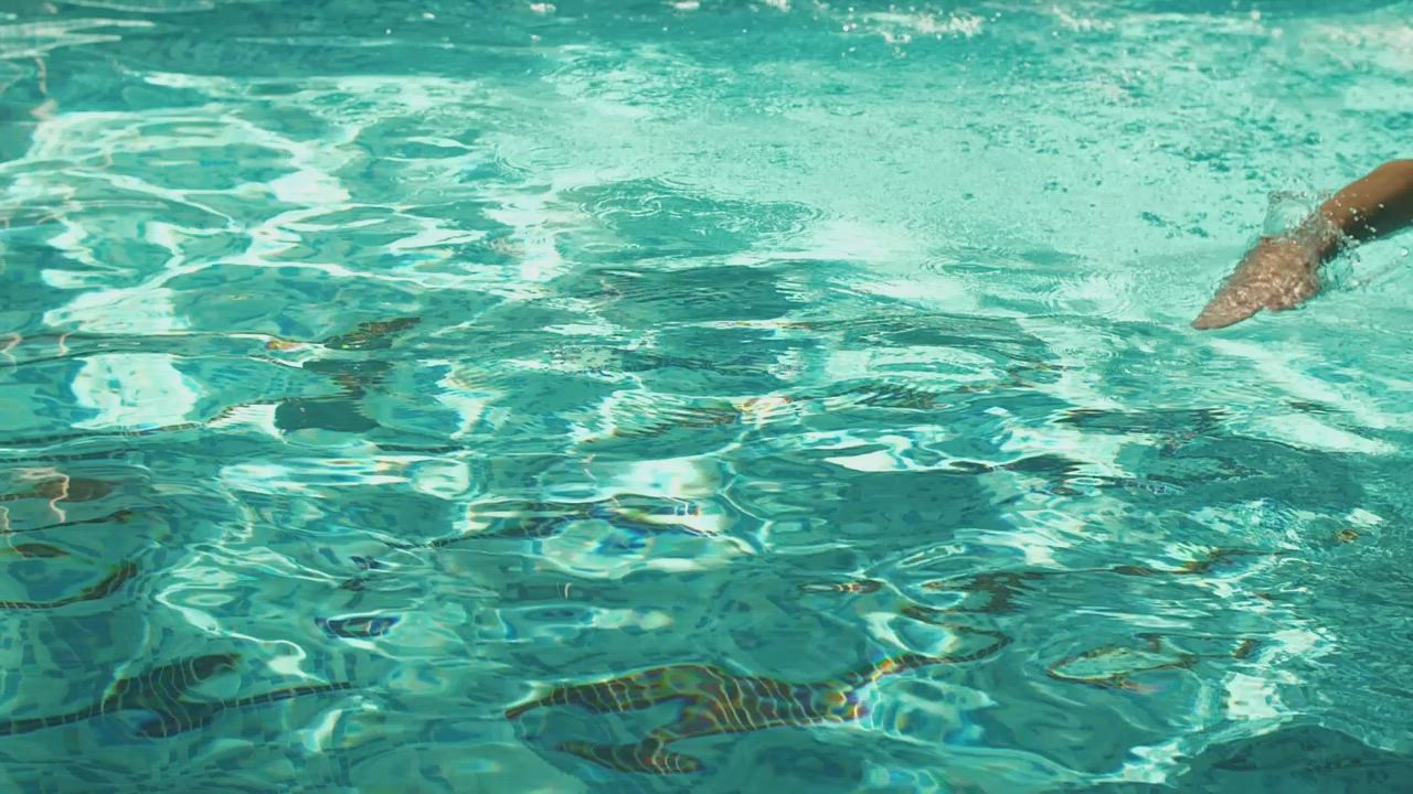 Man swimming in slow motion in the pool - Free Stock Video