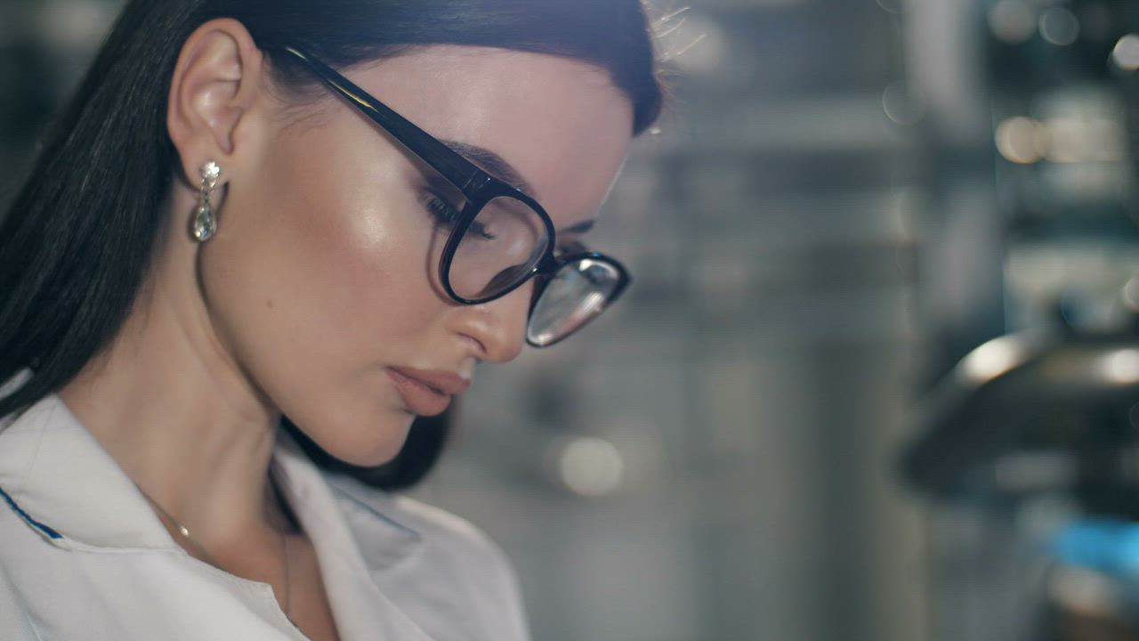 Woman working on tablet in factory - Free Stock Video