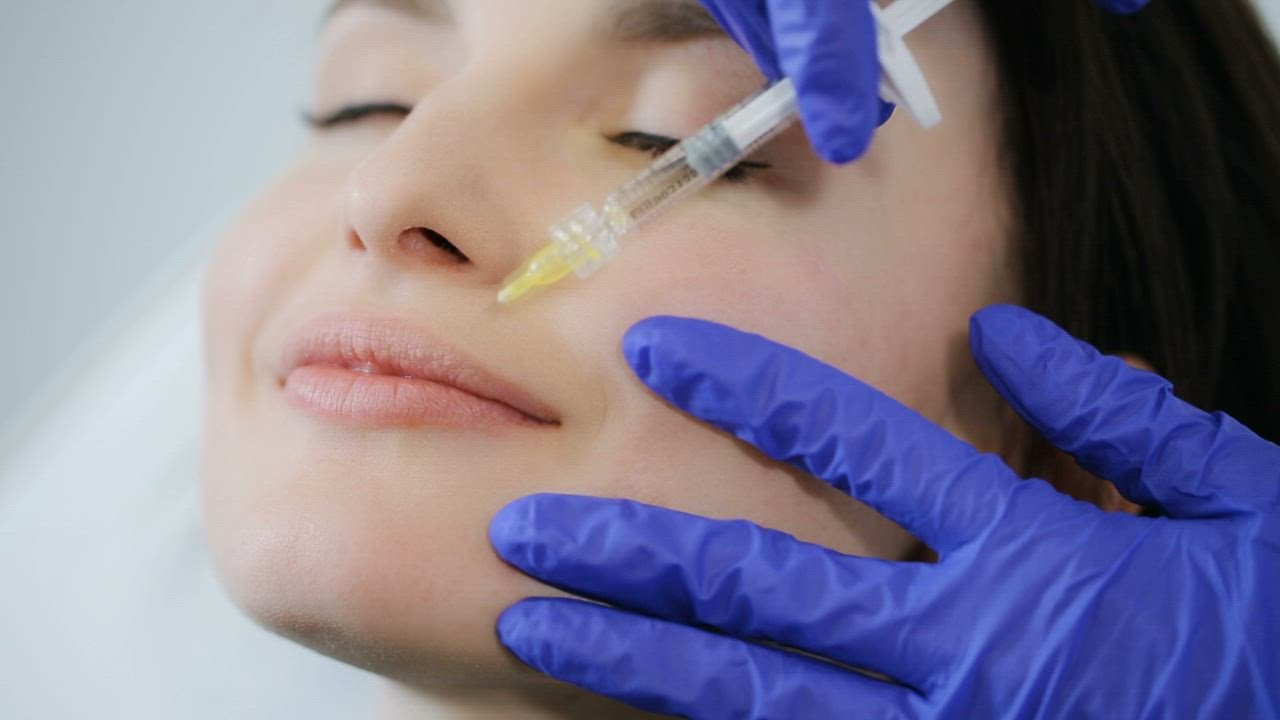 Woman getting botox on her lips, close up - Free Stock Video
